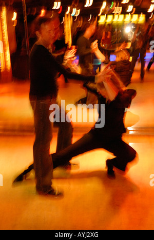 A couple enjoy dancing at a Salsa Club Stock Photo - Alamy