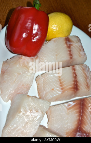 Raw boneless skinless fillet of ling cod cut into pieces for cooking ...