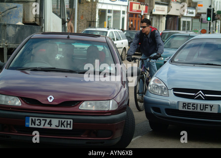 A cyclist makes their way on a road through the Experimental Farm in ...