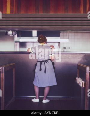 Bored waitress in a diner Stock Photo - Alamy