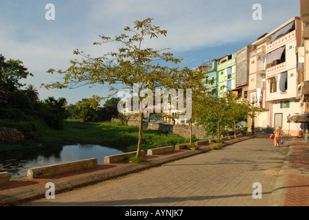 Street and sidewalk next to the moat separating the city citadel of Hue ...