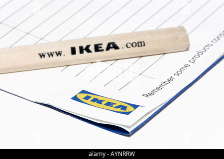An Ikea shopping list order form and pencil on a black table Stock ...