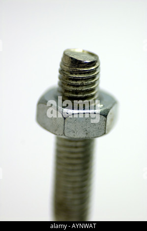 Threaded bolt and nut in metal bracket Stock Photo - Alamy