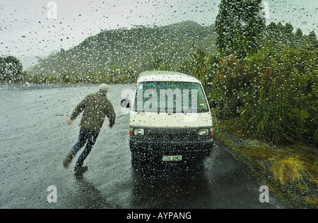 A man seen running in rain at the Jama Masjid. (Photo by Manish Rajput ...
