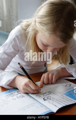 little girl doing maths homework Stock Photo - Alamy