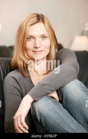 photo of a pleasant, relaxed woman sitting behind the wheel of a car ...