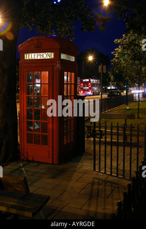 Red phone booth illuminated at night Stock Photo: 101478822 - Alamy