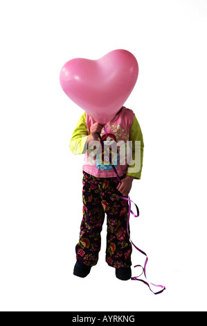 positive kid hold love heart on yellow background, love day. Kid girl ...