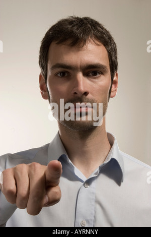 One person's hand points the index finger forward like a pistol ...