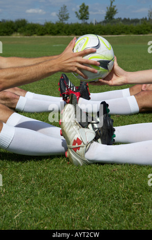 Photography of the hands, legs and feet of four well dressed groomsmen ...