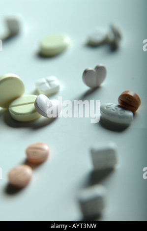 Different colored medicine pills shaped as frame isolated on white ...