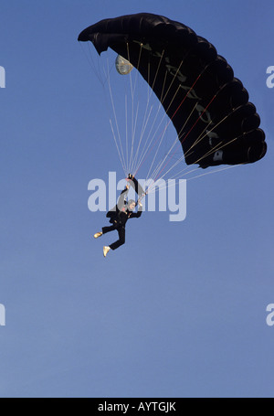 Descending parachutist with a ram-air parachute high above Snohomish ...