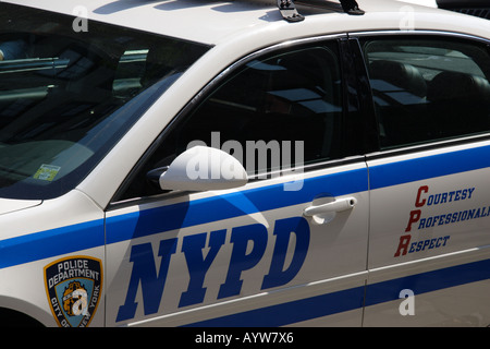 close detail of NYPD police officer and badge on shoulder of uniform ...