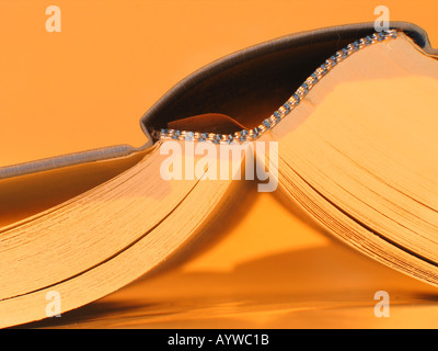 A hard cover printed book opened Pages fanned out with graduated ...