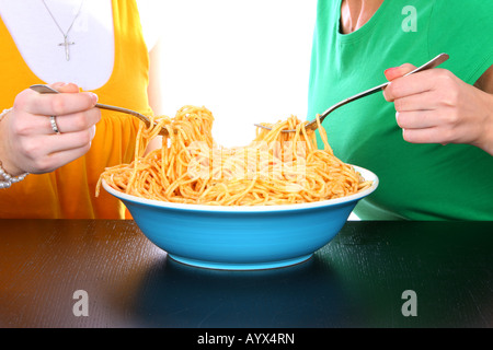 Young Women Eating Spaghetti Model Released Stock Photo - Alamy