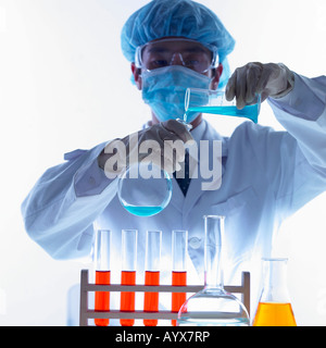 man doing experiment with various fluid Stock Photo - Alamy