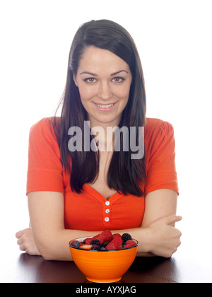 Young Woman with Bowl of Mixed Berries Model Released Stock Photo - Alamy