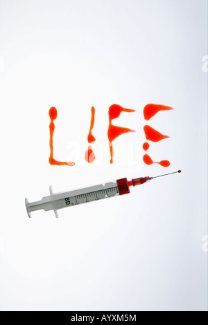 Close up shot of a syringe with the word coronavirus vaccine.The hand ...