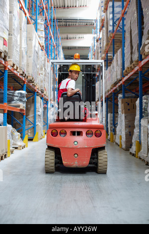 Fork lift truck on back view of Topps Tiles trailer transport behind ...