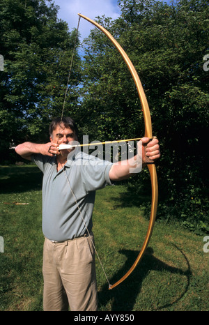 Bow and arrow maker Christopher Boyton using one of his longbow he's ...