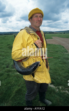 Salmon putcher ranks Stock Photo - Alamy