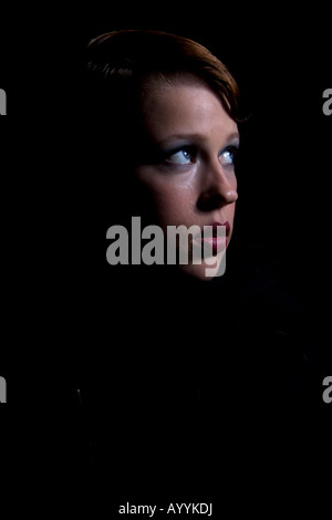 girl against a black background Stock Photo - Alamy
