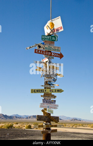 Crazy Sign Post in the Desert Stock Photo - Alamy