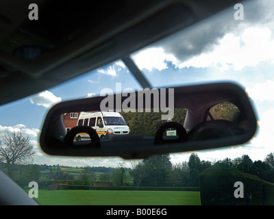 Ambulance in rear view mirror Stock Photo - Alamy
