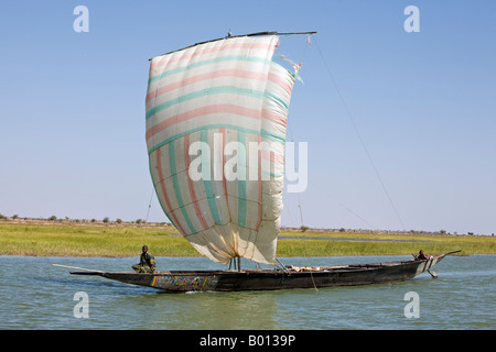 Mali, Niger Inland Delta. A pirogue under sail on the Niger River ...