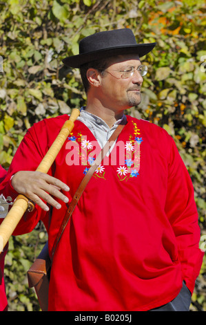 A Swiss alphorn player Stock Photo - Alamy