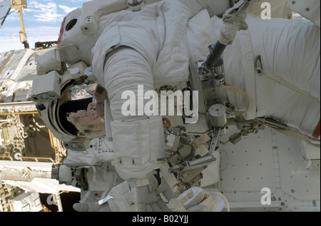 Astronaut participating in extravehicular activity Stock Photo - Alamy