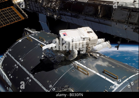 Astronaut participating in extravehicular activity Stock Photo - Alamy