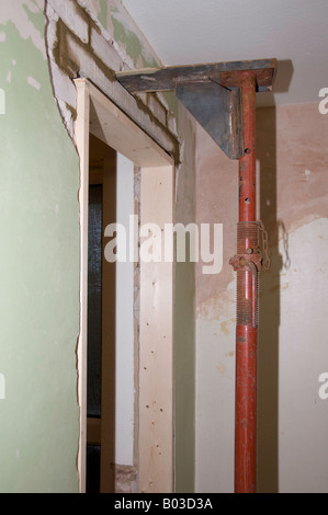 Acro prop holding up brickwork Stock Photo - Alamy