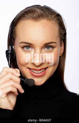 Young female telemarketer with blue background and world map and numbers behind her Stock Photo ...