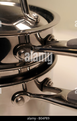 Close-up of a stack of stainless steel cooking pots Stock Photo - Alamy