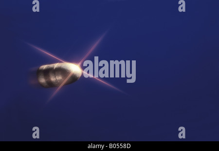 silver bullet flying through air Stock Photo - Alamy