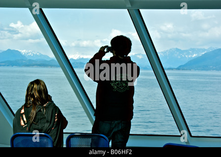 Passengers enjoying the spectacular vistas while sailing across Georgia ...