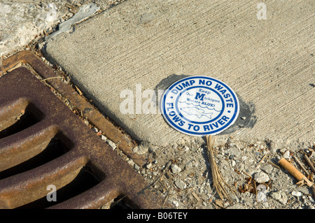 Storm drain grate with dump no waste drains to river warning. Oak Park ...
