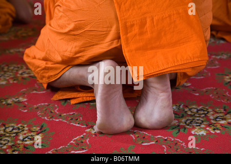 THAI HINAYANA MONKS worship at the Buddhist Temple of WAT INTHARAVIHAN ...