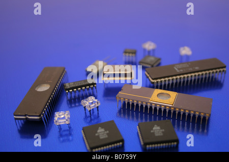 Various semiconductor chips, LEDs, and crystals on a blue background ...