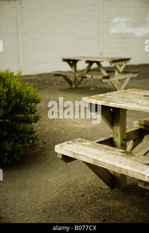 rural landscape with wooden table with benches and yellow umbrella on a ...