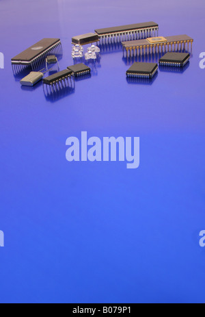 Various semiconductor chips, LEDs, and crystals on a blue background ...