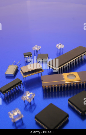 Various semiconductor chips, LEDs, and crystals on a blue background ...