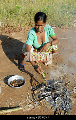 Aboriginal woman cooking outside in Bathurst, Tiwi islands, Australia ...