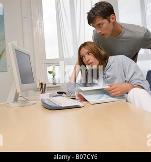 Man staring at computer monitor in data center Stock Photo - Alamy