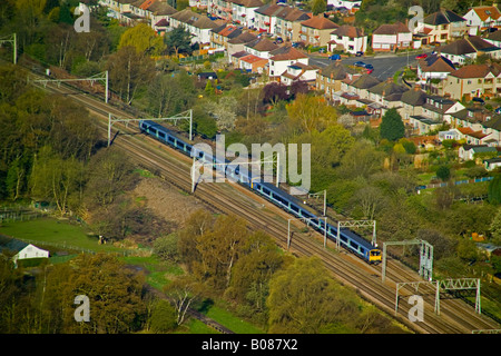 Aerial view of a railway line meandering through a densely populated ...