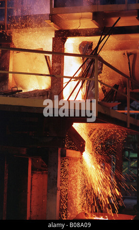 Smelting of ores (gold, silver, copper and lead). Workman beats clay to ...