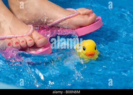 Water splash toes paddling pool summer fun Stock Photo - Alamy