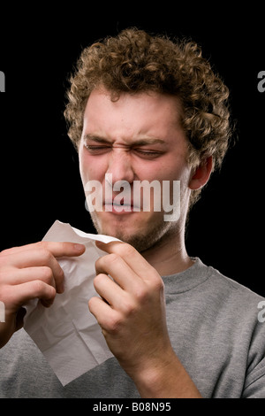Young man is about to sneeze being ill Stock Photo - Alamy
