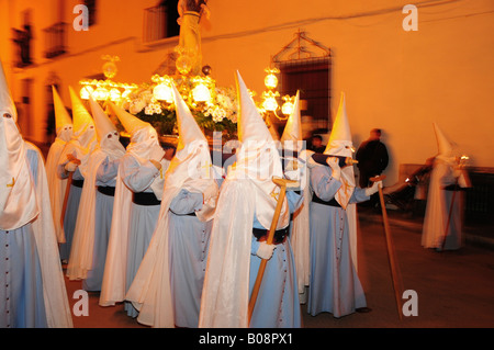 Penitents wearing penitential robes (nazareno), Holy Week procession ...